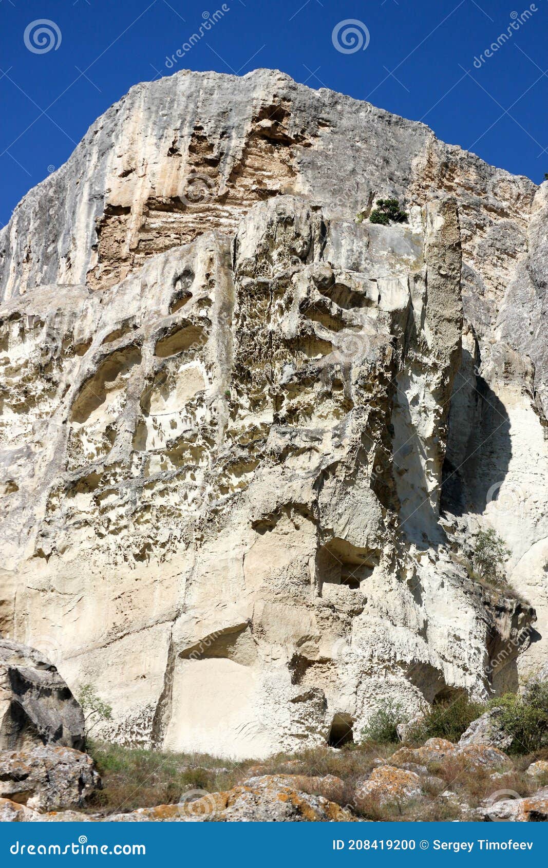 Scenic Limestone Cliff with Caves with Azure Sky Background in Crimea ...
