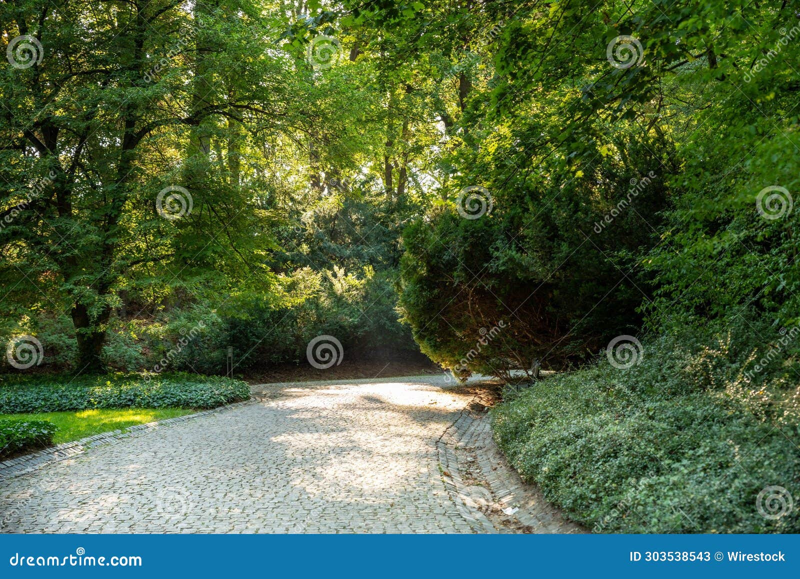 Scenic Pathway in a Park with Large Rocks on the Edges and Lush ...