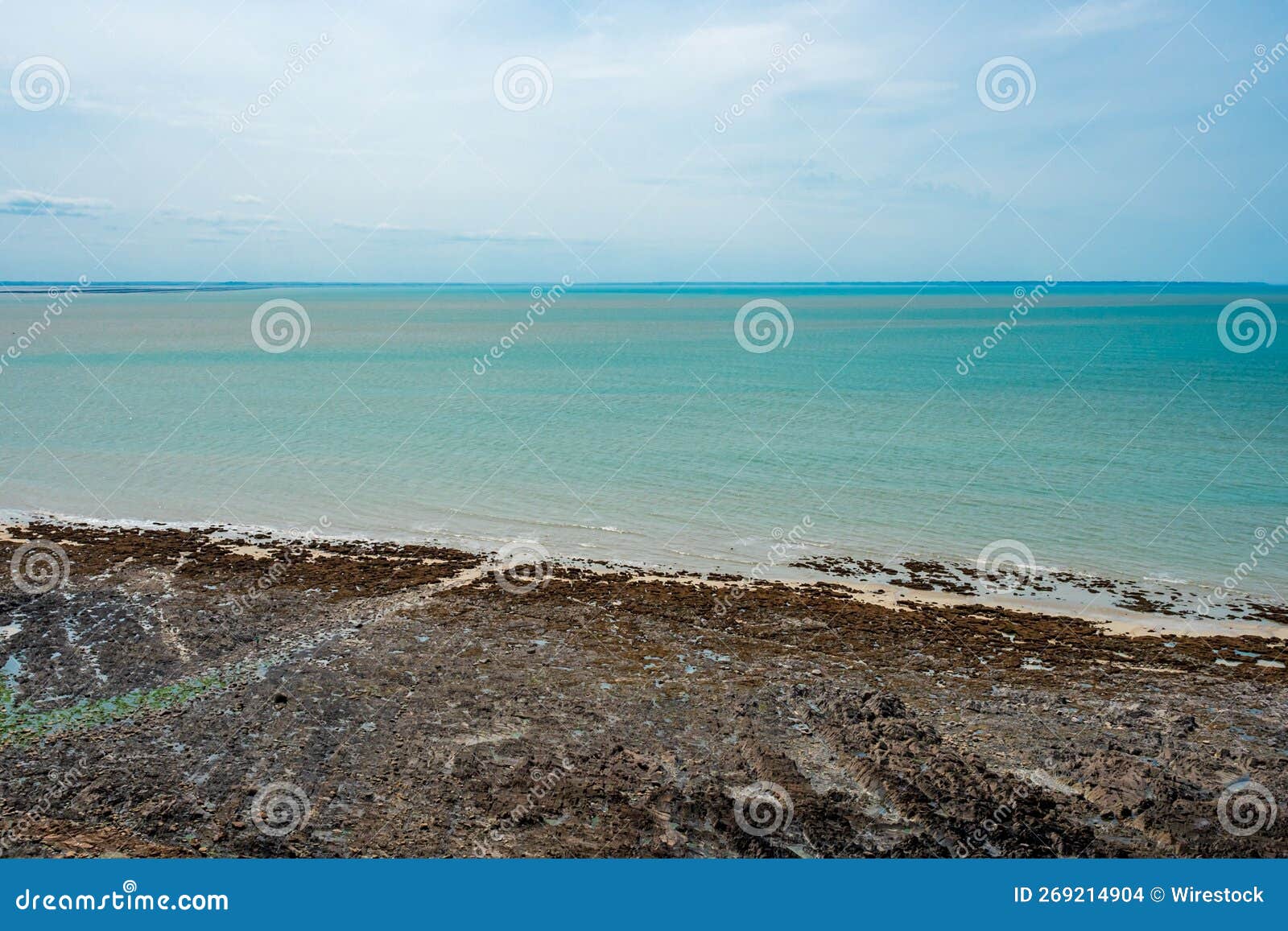 Scenic Shot of a Rocky Coastal Beach and a Cloudy Sky Stock Photo ...
