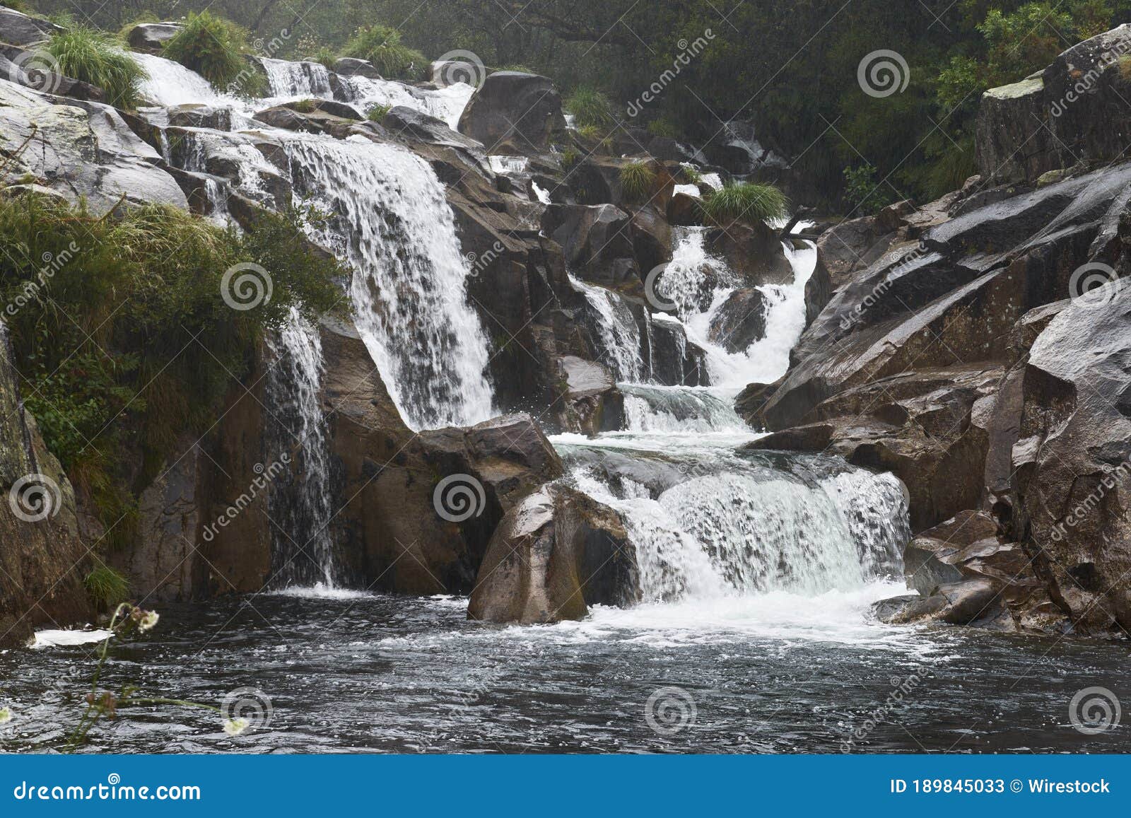 Scenic Shot of a Rocky Waterfall in a Forest during a Rainy Day Stock ...