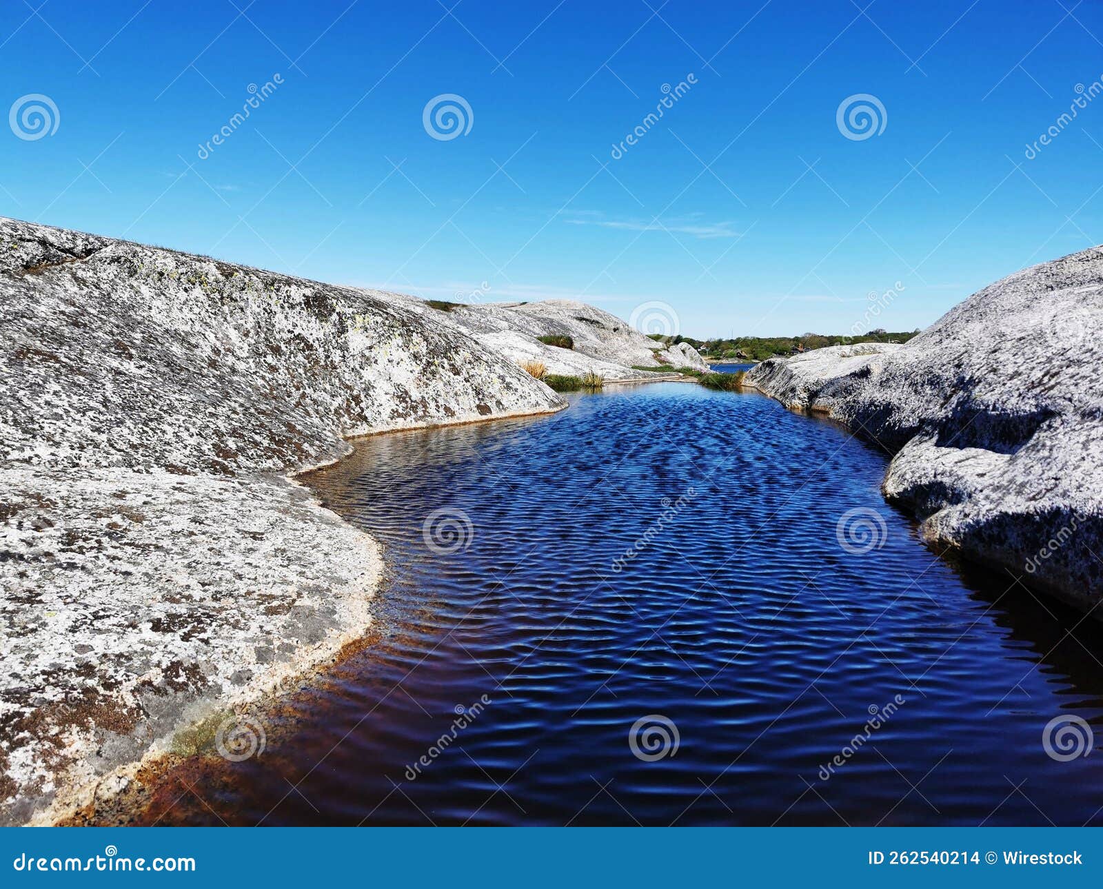 Scenic Shot of a Sea Surrounded by Stone Mountains in Verdens Ende ... Scenic Shot of a Sea Surrounded by Stone Mountains in Verdens Ende ...