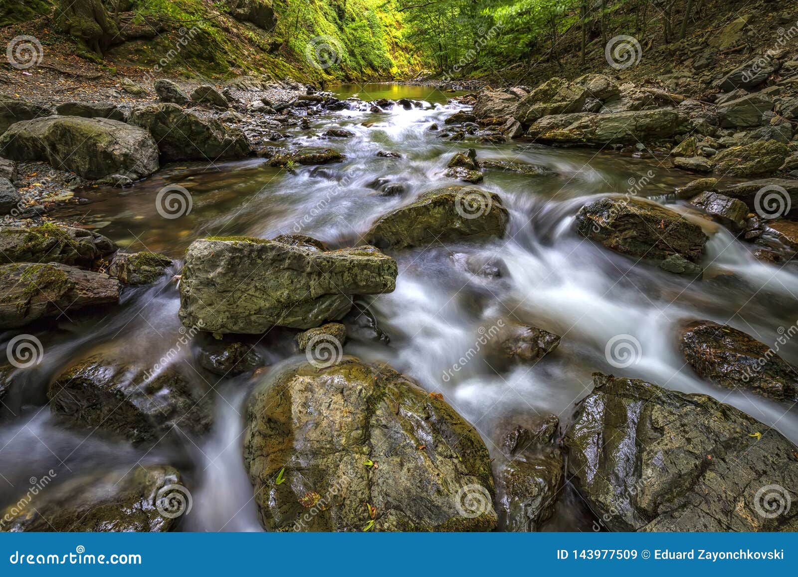 Amazing Water Motion Blur of a Water Stream between Rocks Stock Image ...