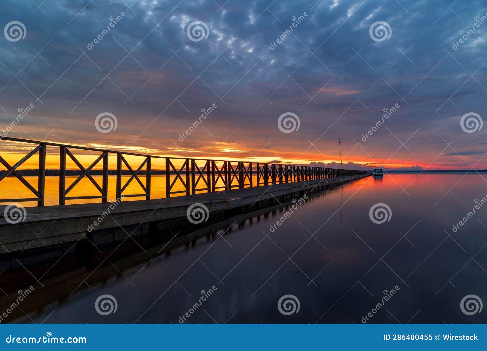 Scenic View of a Bridge Arched Over a Body of Water at Sunset. Stock ...