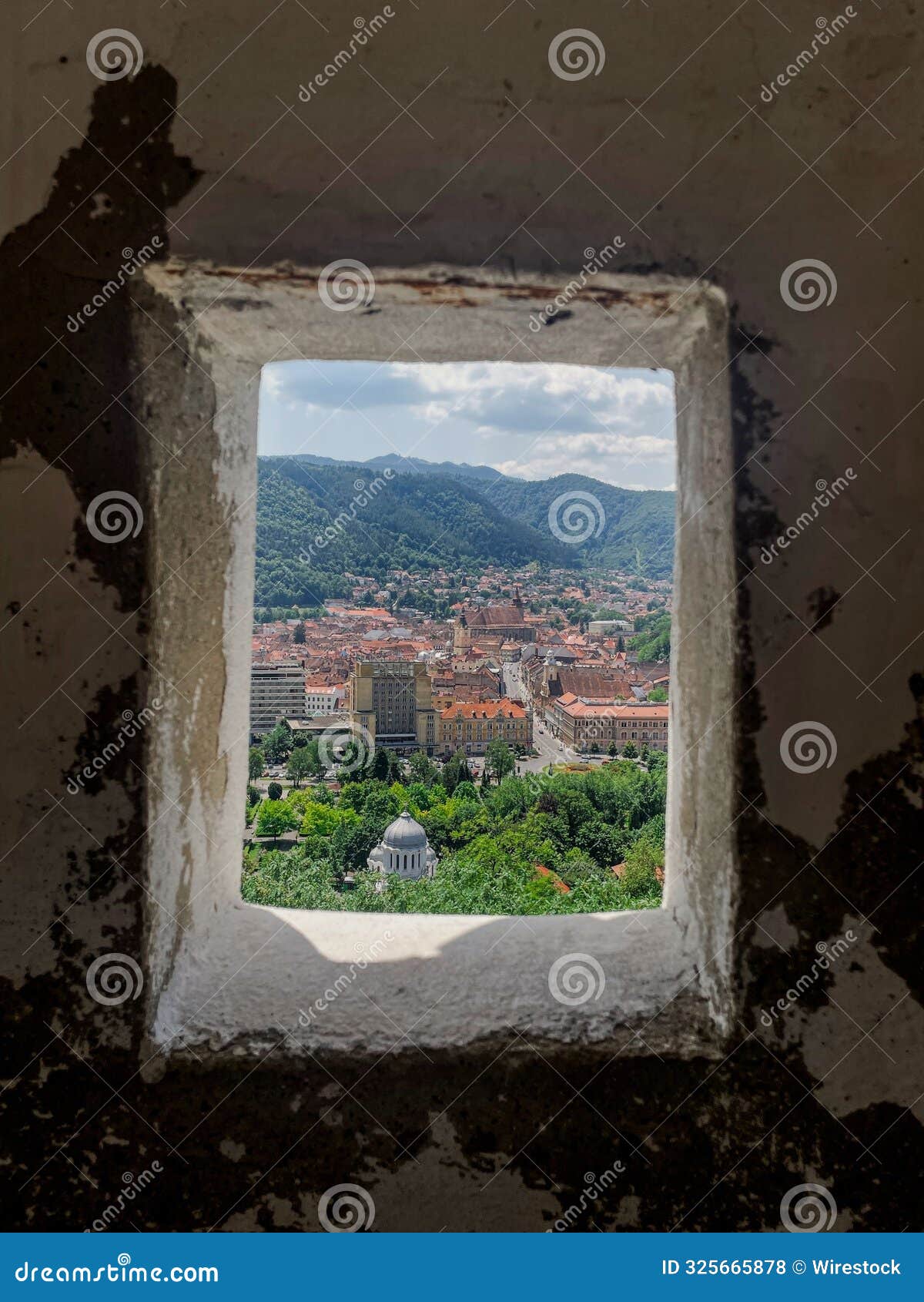 Scenic View of a City through a Worn-out Window Frame, with Mountains ...