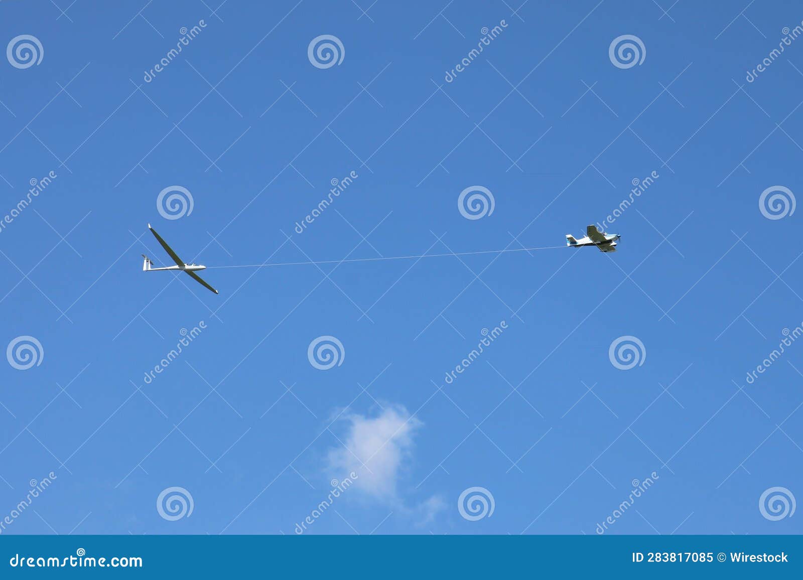 Glider Pulled By Motor Aircraft Stock Photo | CartoonDealer.com #143493348