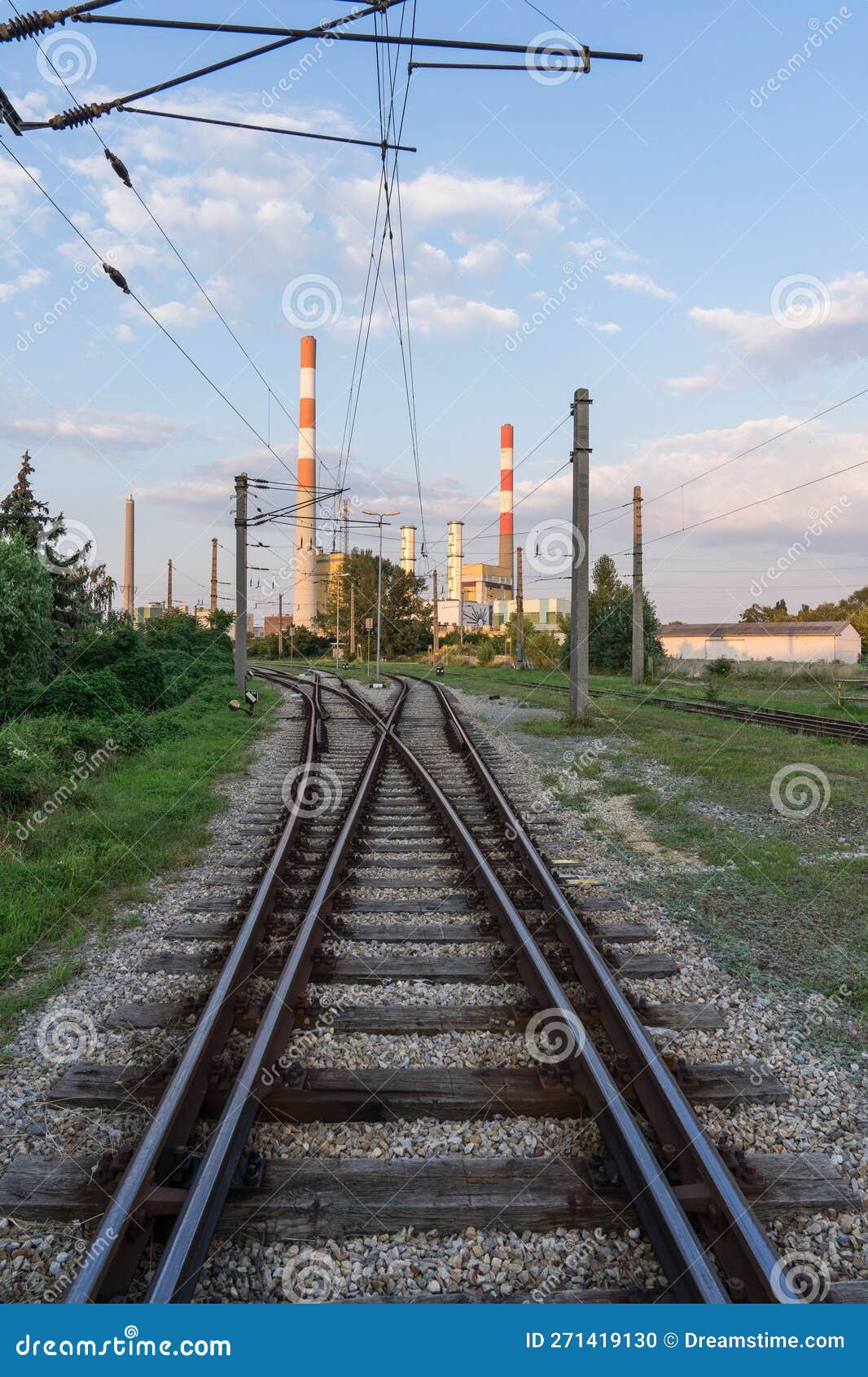 Scenic View of an Industrial Complex Featuring Multiple Train Tracks ...