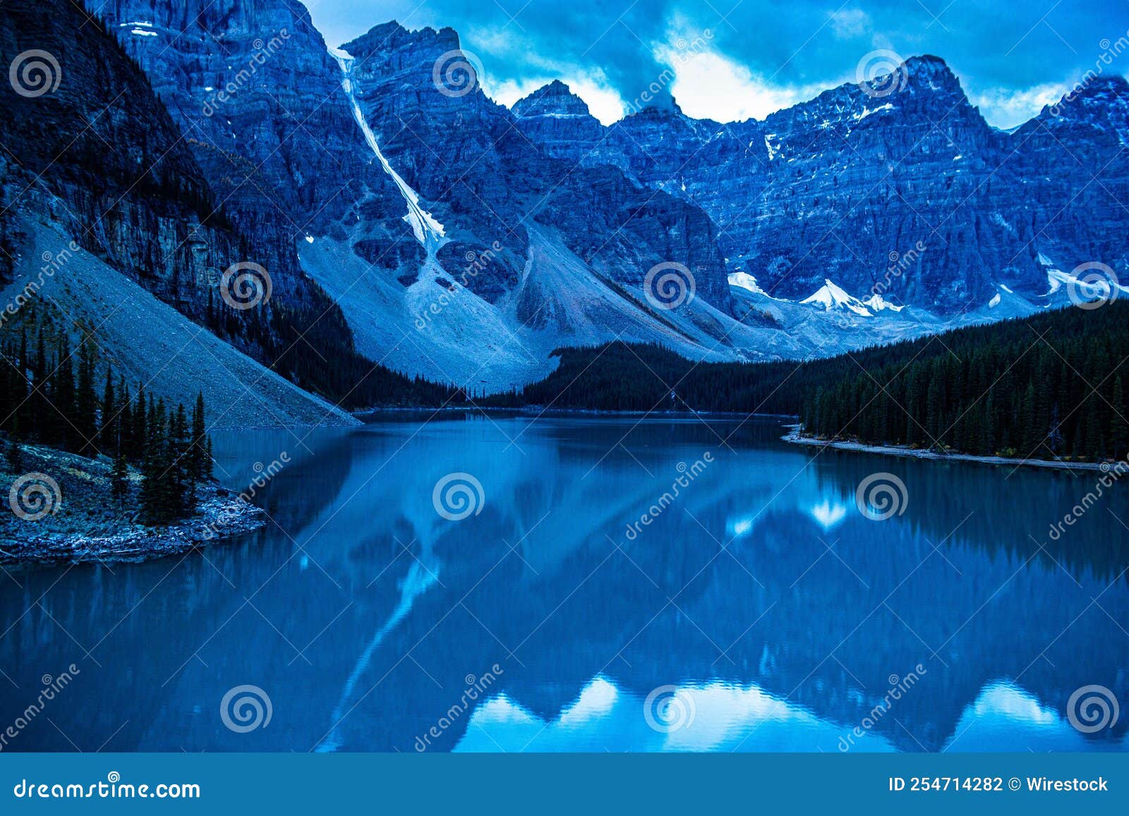 Scenic View of the Lake, Trees, and Mountains of Banff at Night Stock ...