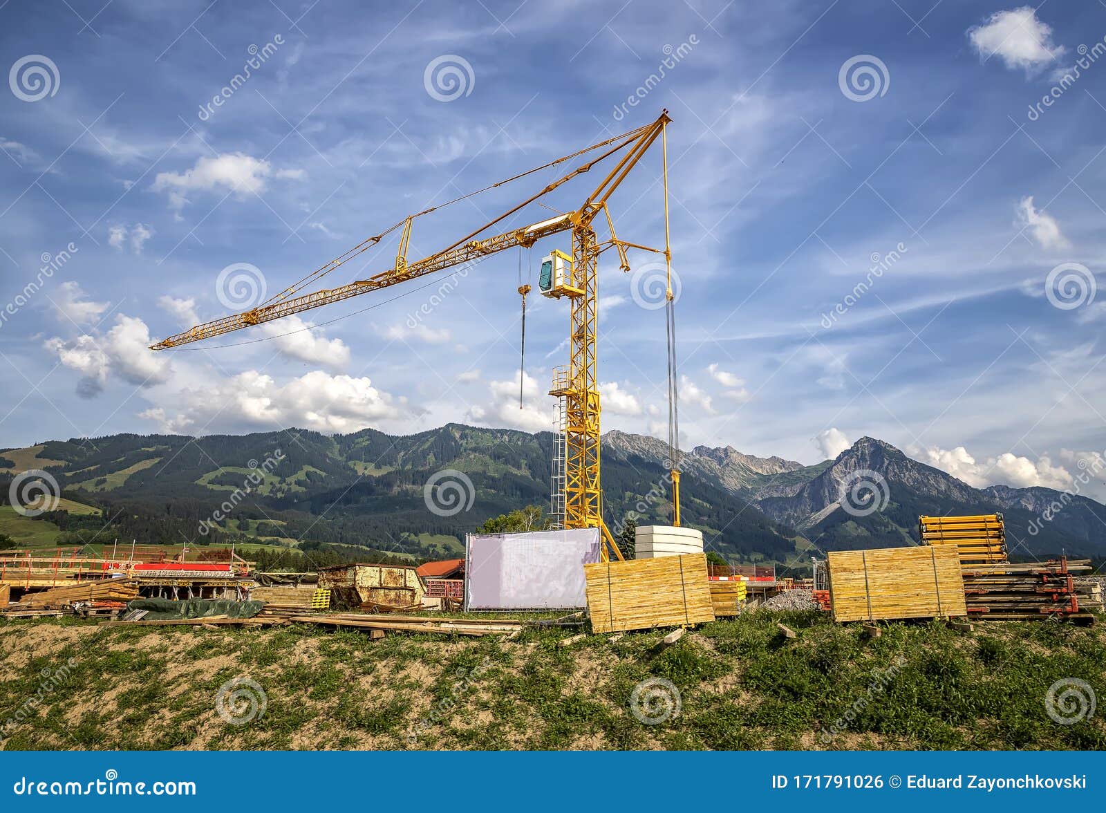 A New Construction Site with Crane and Building Materials Stock Photo ...
