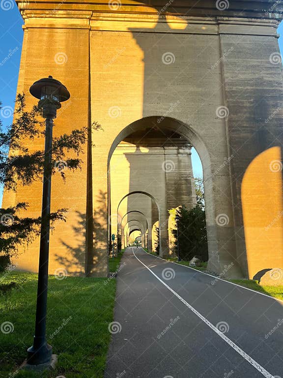 Scenic View of a Pathway Under a Series of Large Stone Arches with ...