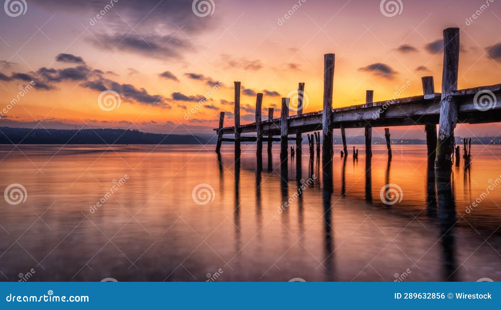 Scenic View of a Pier on the Sea at Golden Sunset Stock Photo - Image ...