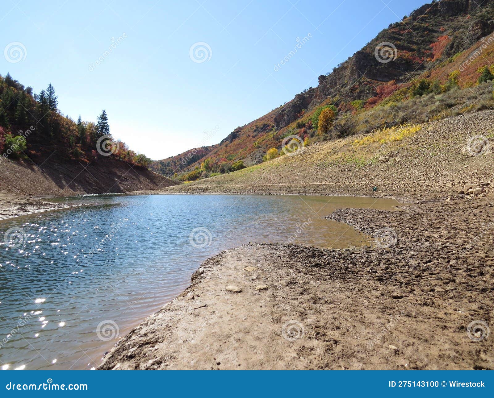 Scenic View of a Riverfront with a Mountain Backdrop in the Fall in ...