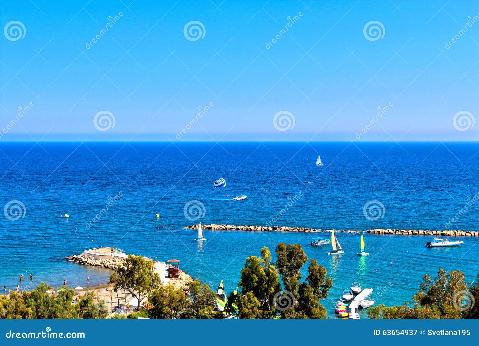 Scenic View of Sandy Beach with a Pier with Yachts and Boats Stock ...