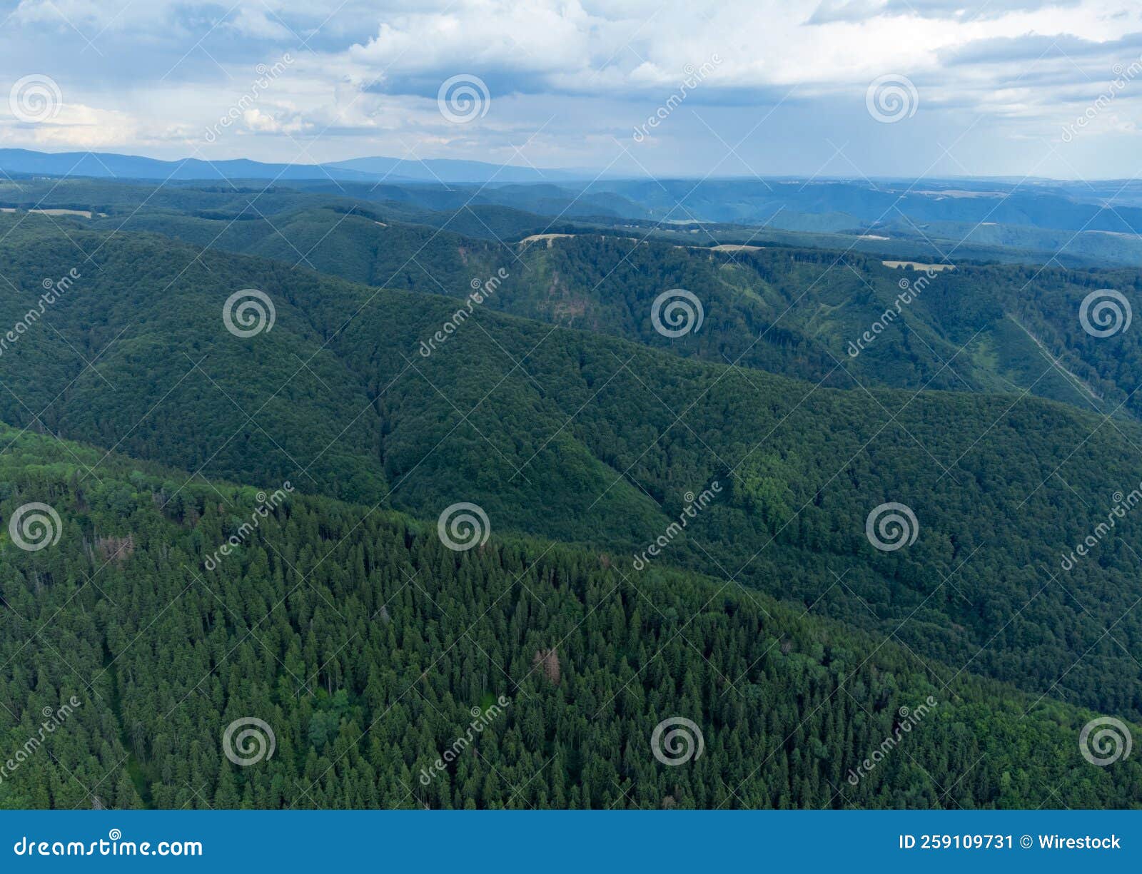 Scenic View of Successive Mountains Covered with Dense Forests Under ...