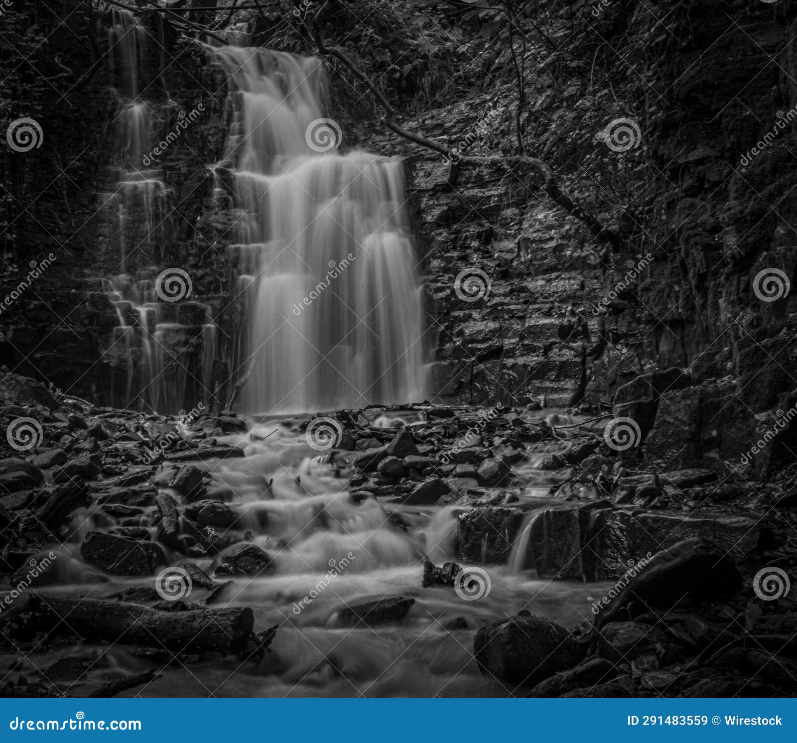 Scenic View of a Waterfall Cascading Down the Rocks Stock Image - Image ...