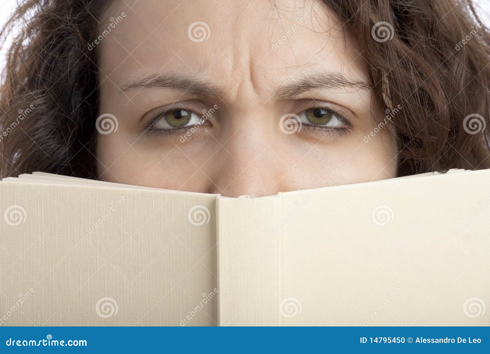 Sceptical Girl with Book stock photo. Image of girl, frown - 14795450