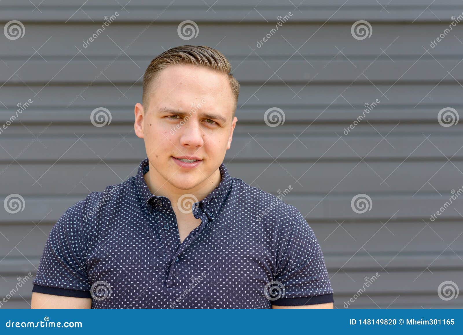 Sceptical Young Man Staring at the Camera Stock Photo - Image of ...