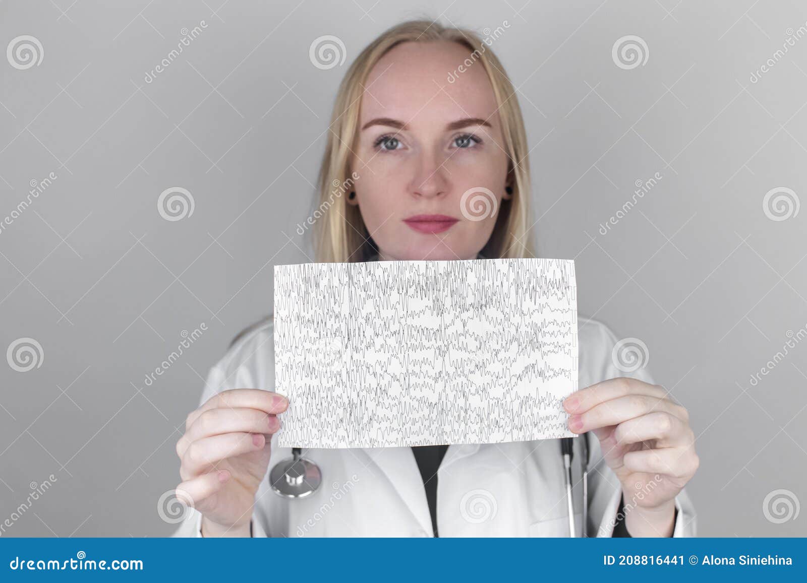 A Neurologist Examines an Encephalogram of a Patientâ€™s Brain ...