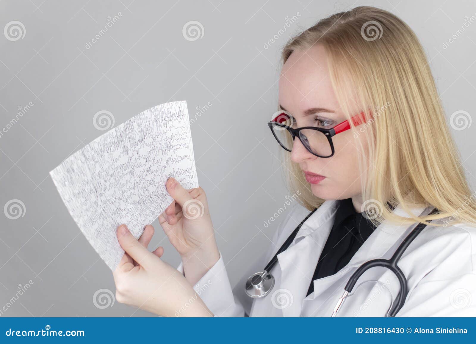 A Neurologist Examines an Encephalogram of a Patientâ€™s Brain ...