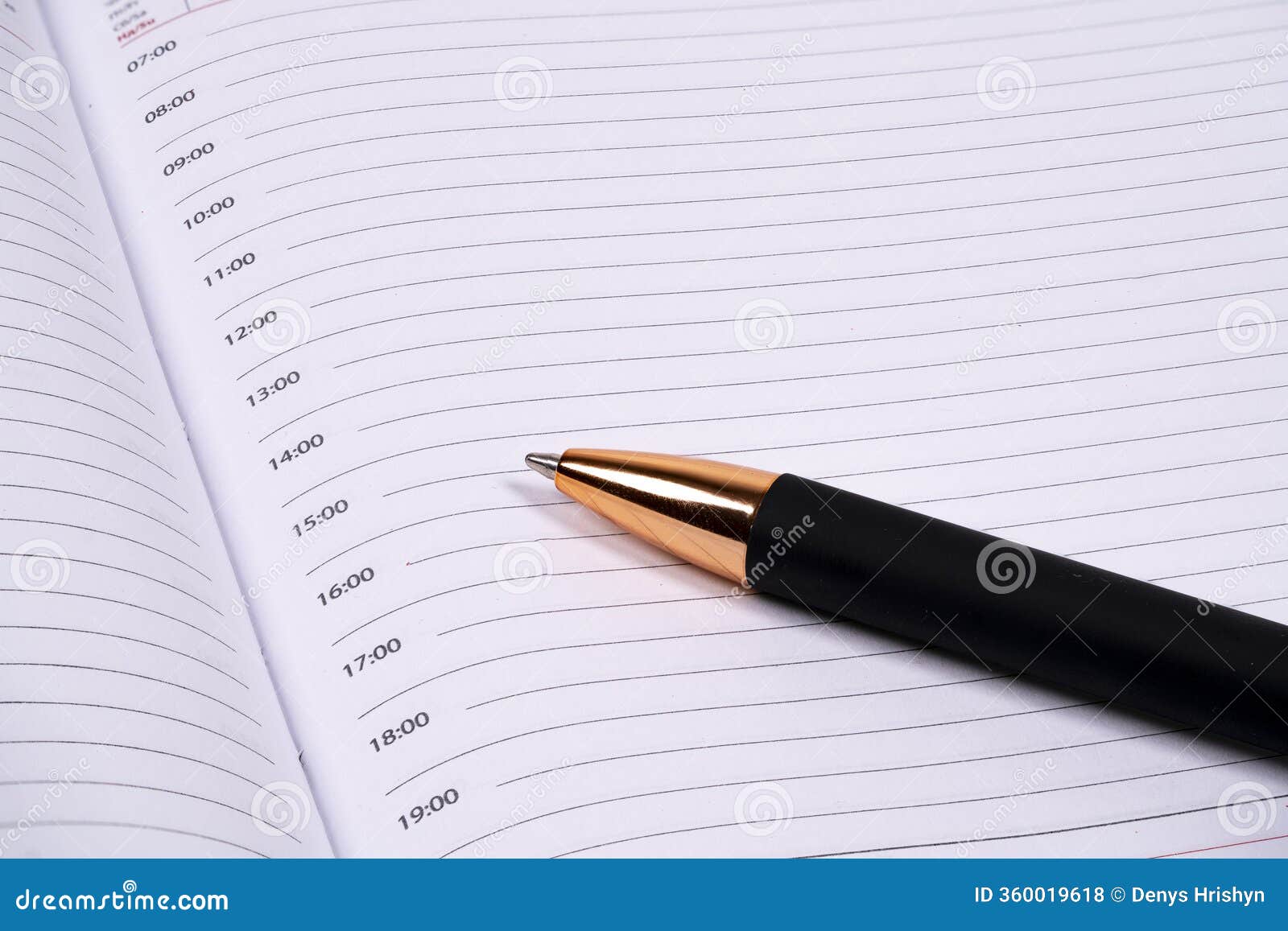 Scheduling Tasks with a Pen on a Blank Planner Page Stock Photo - Image ...