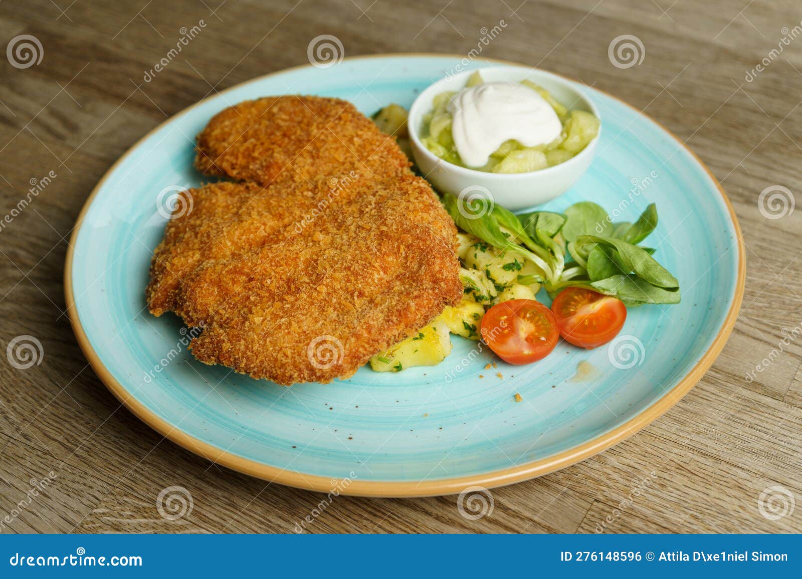 Schnitzel, Fried Chicken with Cucumber Salad and Vegetables Stock Photo ...