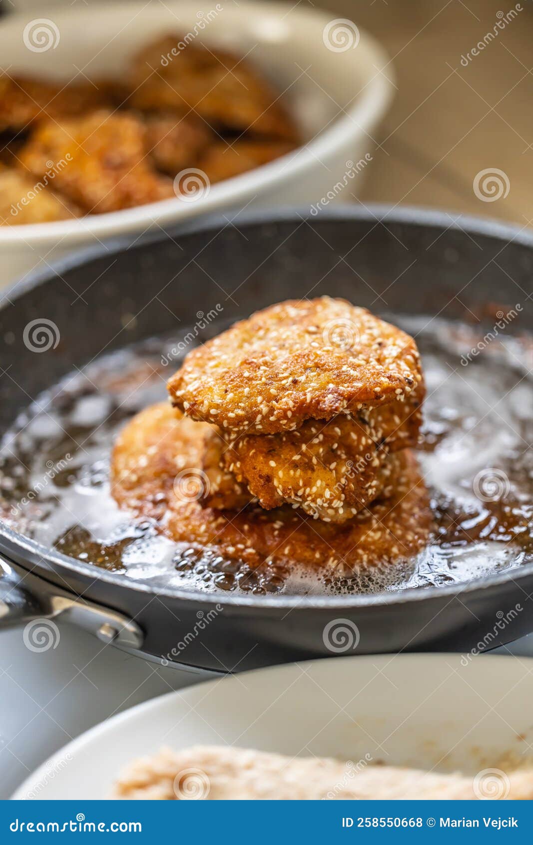 Schnitzels with Sesame Seeds in a Frying Pan Stock Photo - Image of ...