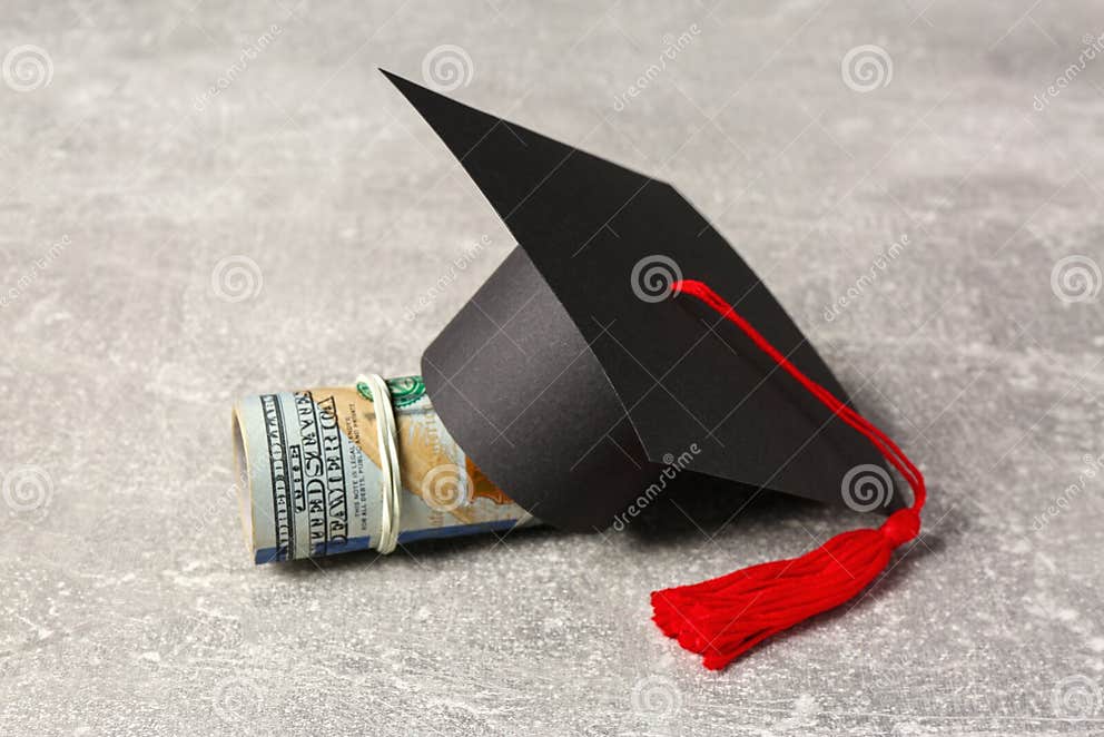 Scholarship Concept. Graduation Cap and Banknotes on Light Grey Table ...