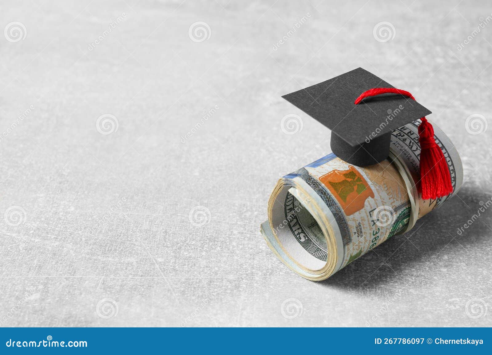 Scholarship Concept. Graduation Cap and Banknotes on Light Grey Table ...