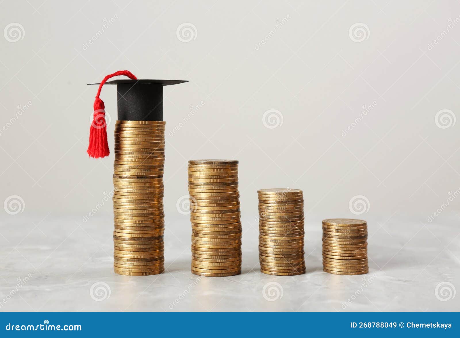 Scholarship Concept. Graduation Cap and Stacked Coins on Light Grey ...