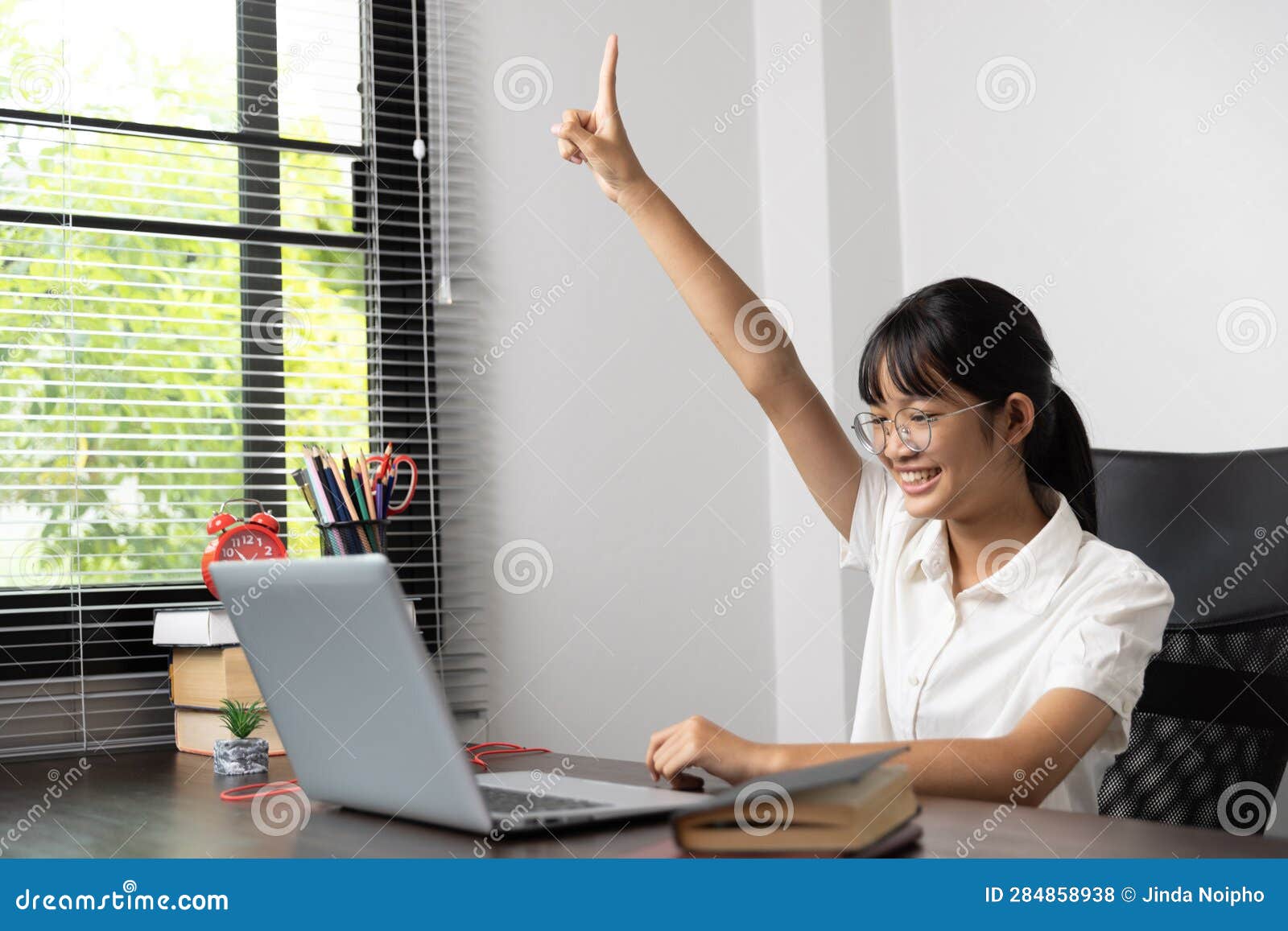 School Age Student Doing Her Homework with Digital Tablet at Home ...