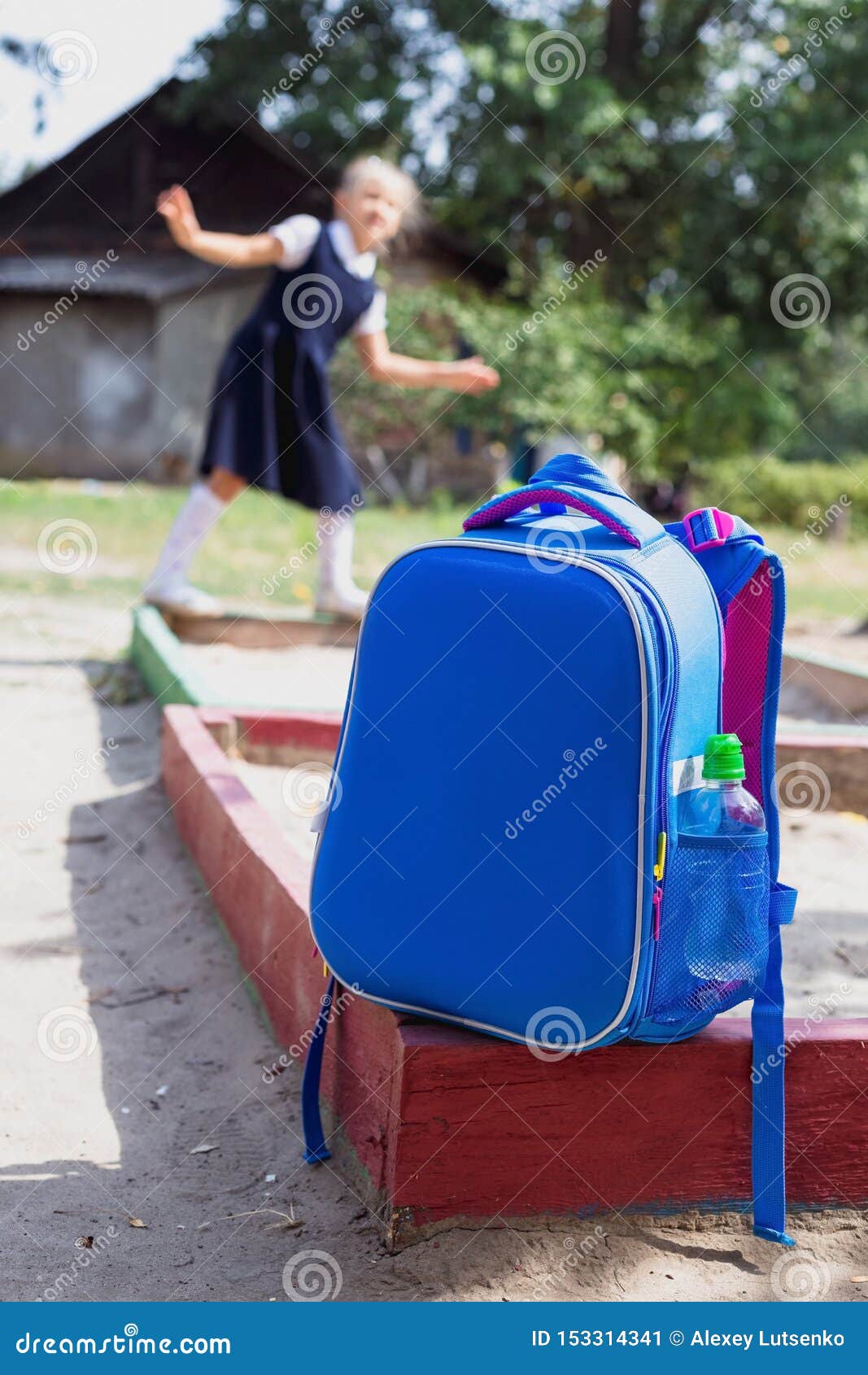School Bag and an Elementary Student on Playground Stock Image - Image ...