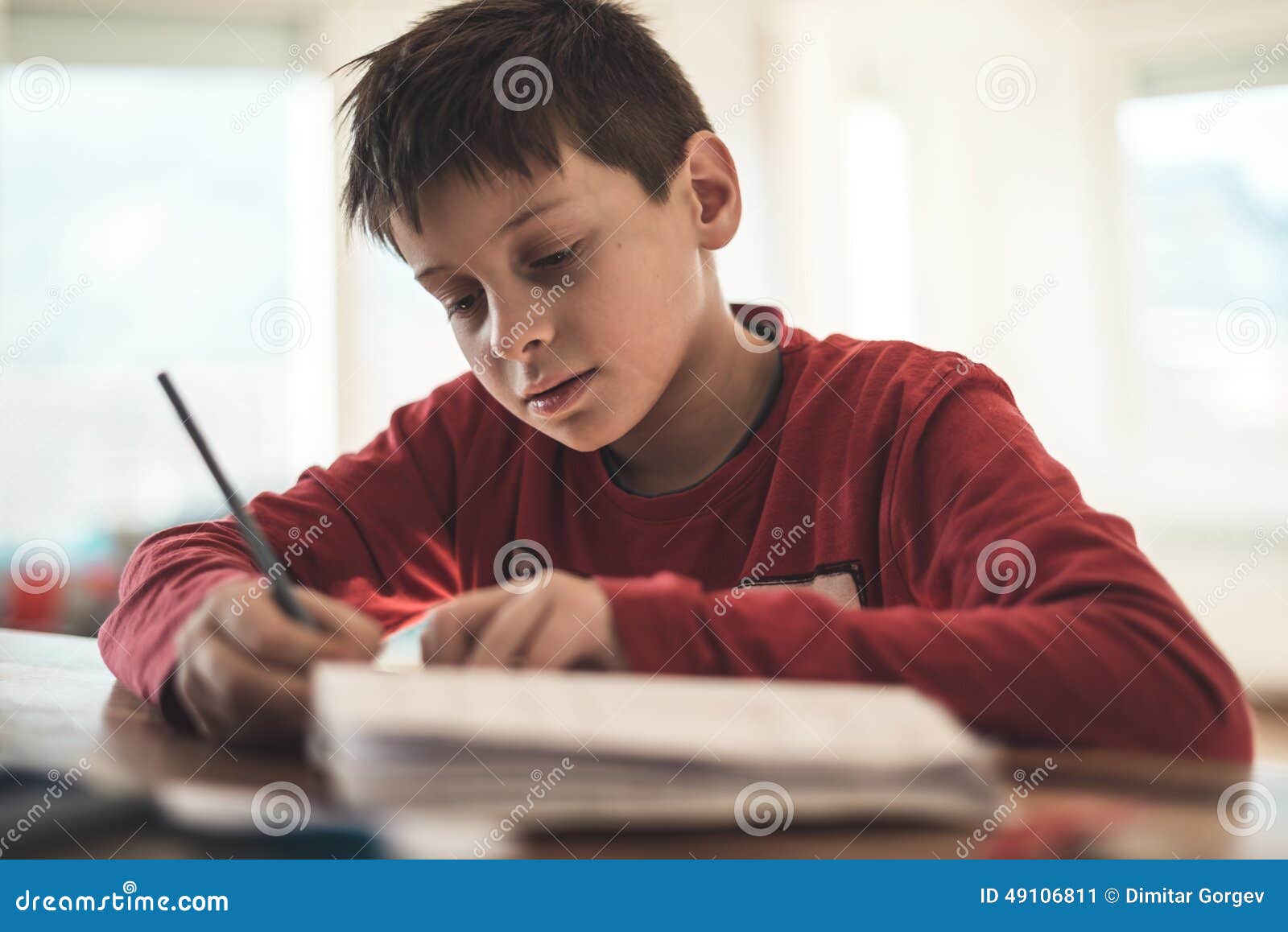 School boy doing homework stock image. Image of learning - 49106811
