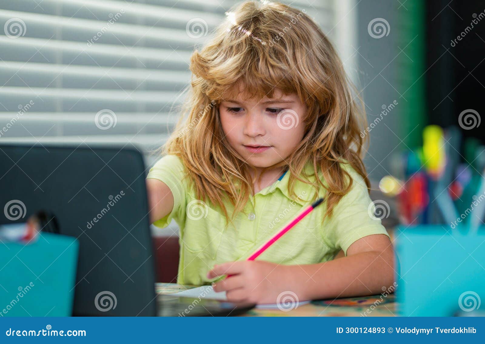 School Boy Doing Homework Writing and Reading at Home. Concentrated ...