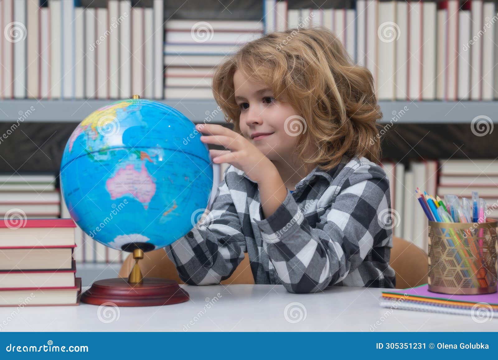School Boy Looking at Globe in Library, Geography Lesson. School Child ...