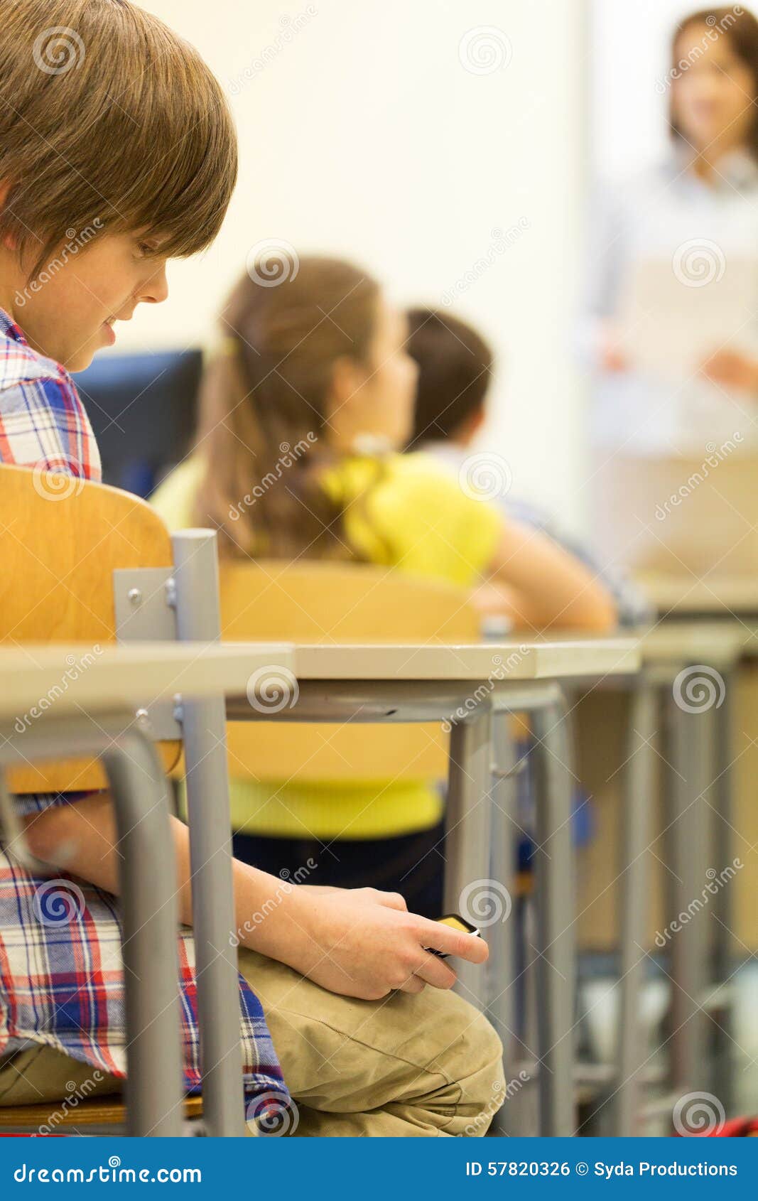 School Boy with Smartphone on Lesson at Classroom Stock Photo - Image ...