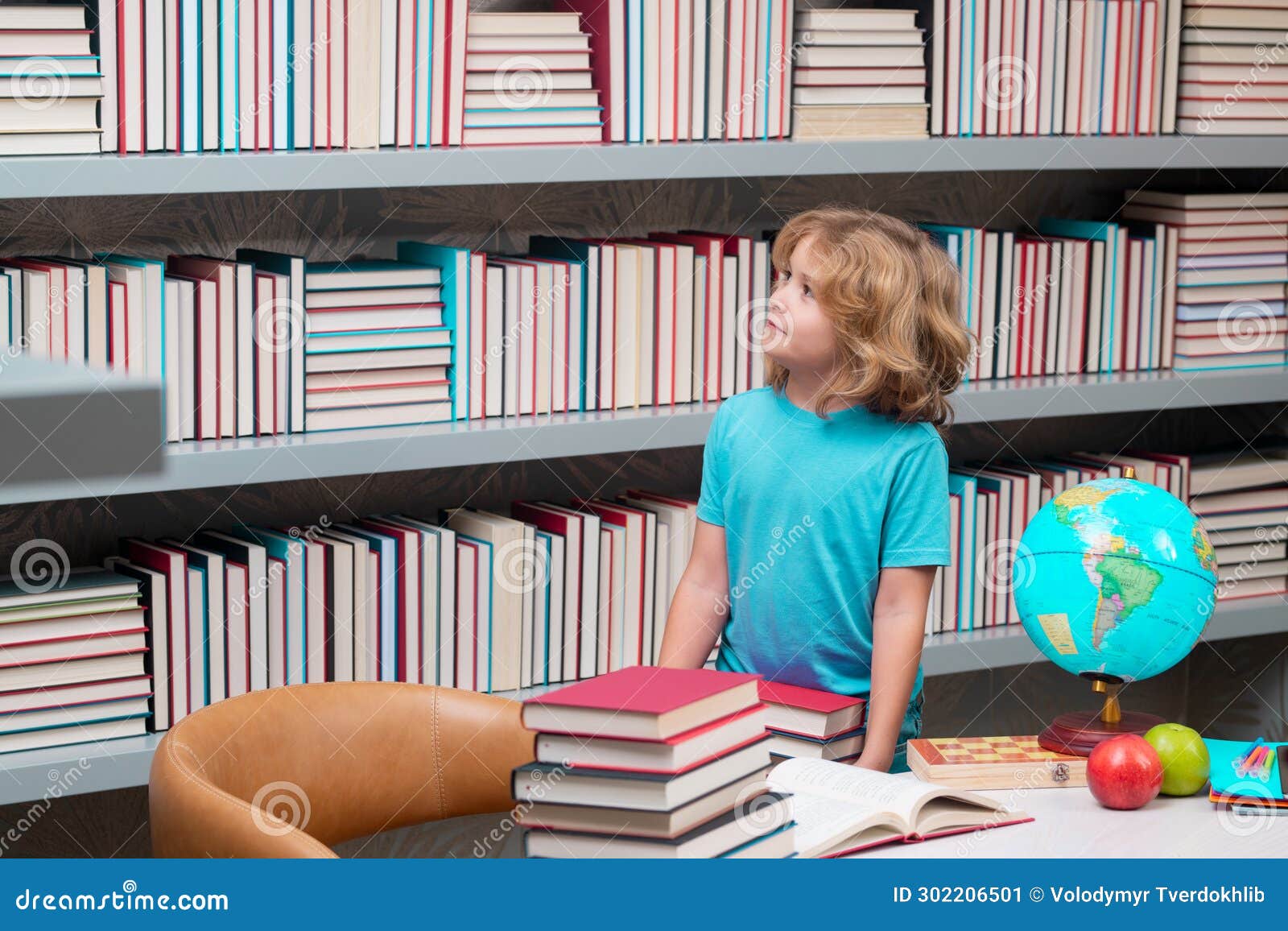 School Boy with Stack of Books in Library. Kid Boy from Elementary ...