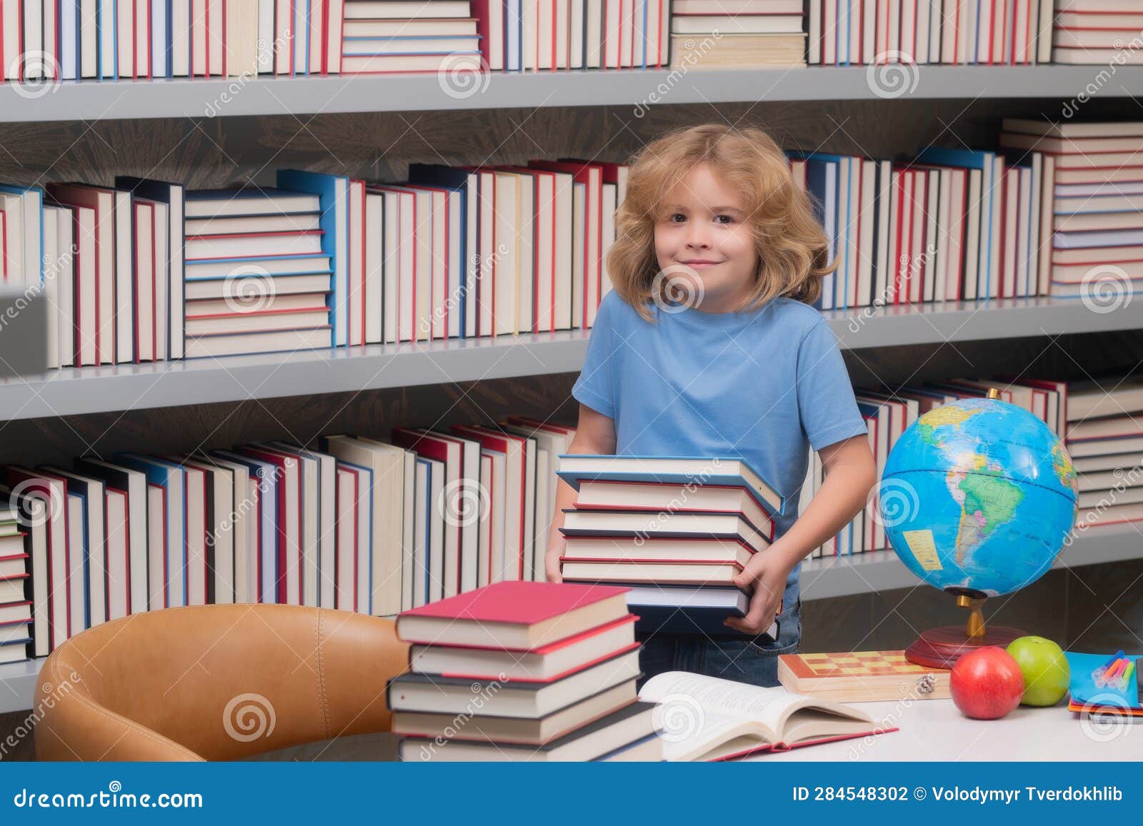 School Boy with Stack of Books in Library. School Kid Student Learning ...