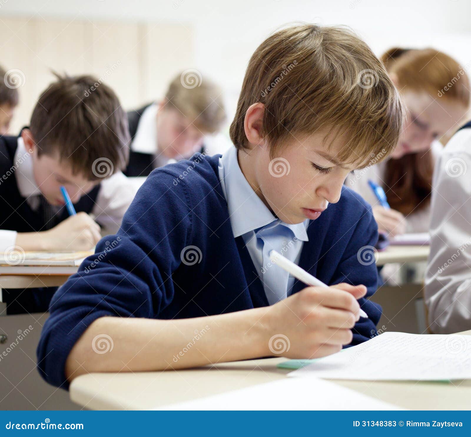 School Boy Struggling To Finish Test in Class. Stock Image - Image of ...