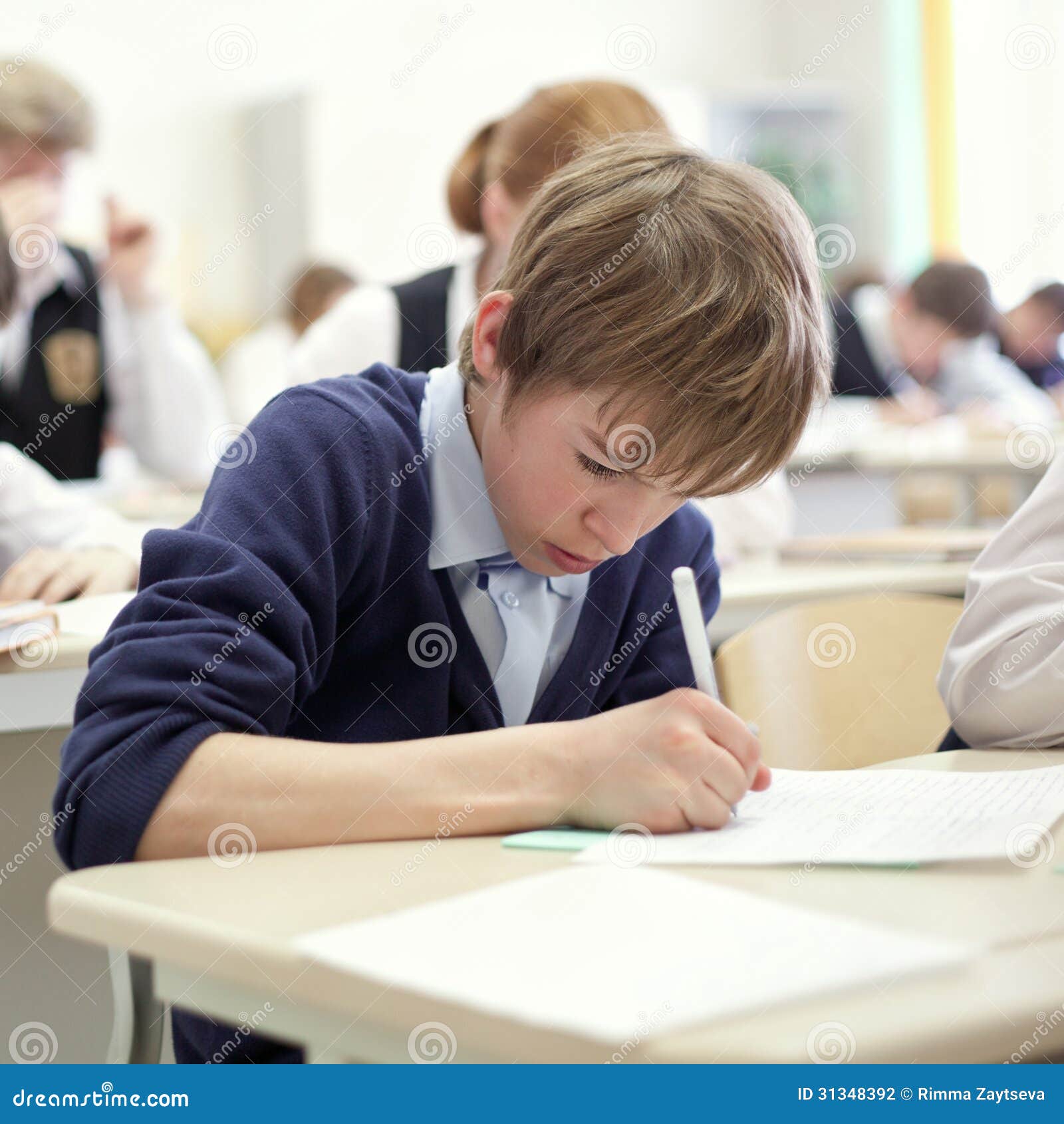 School Boy Struggling To Finish Test In Class. Stock Photography ...