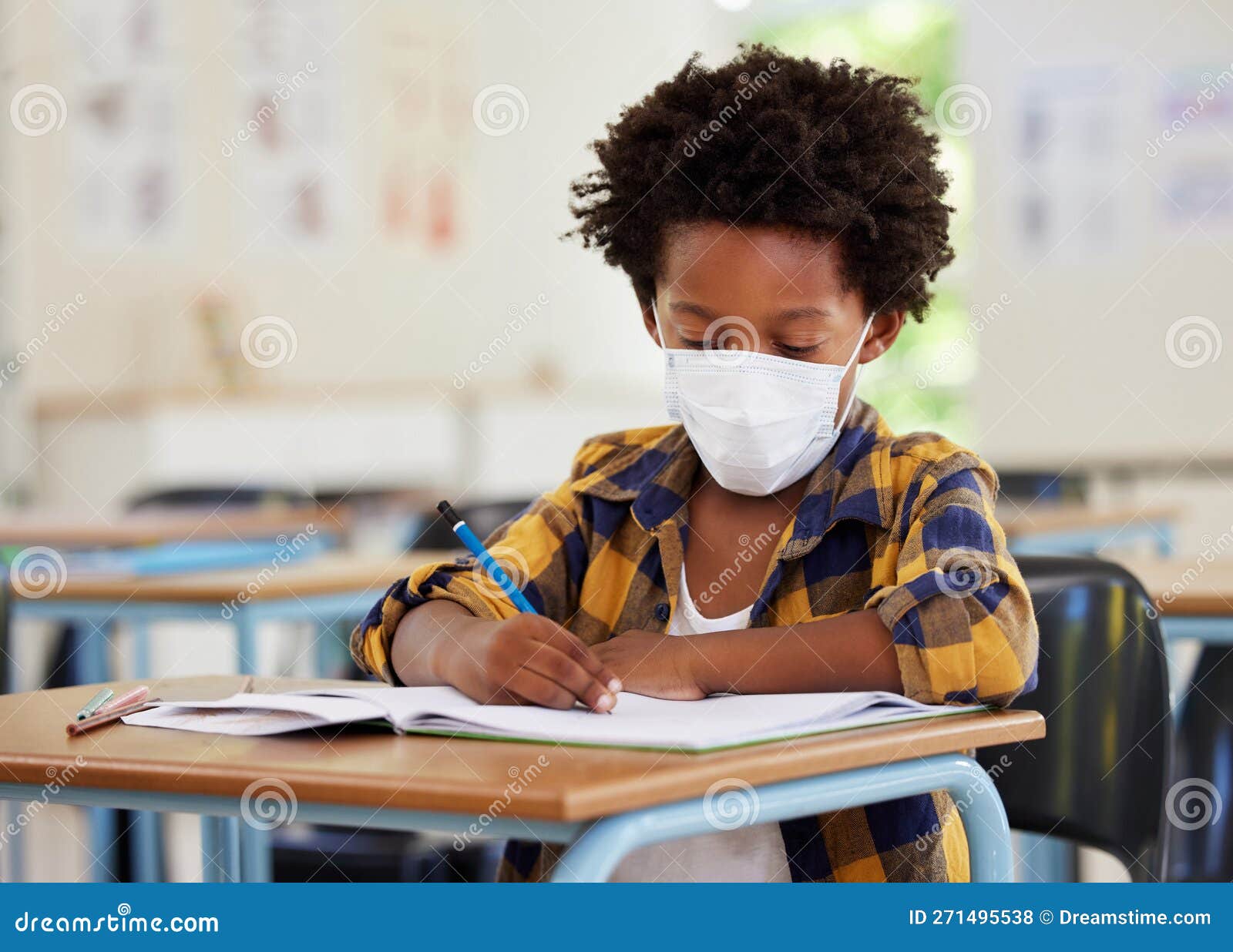 School Boy, Student and Learning while Writing and Working in His Book ...