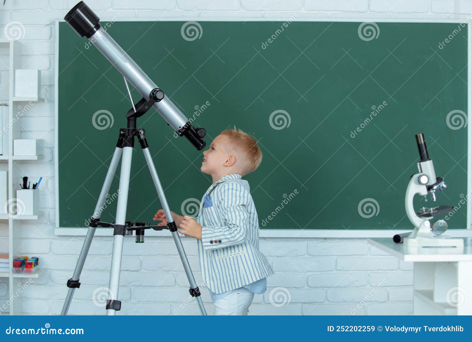 School Boy with Telescope Learning Astronomy Lesson at School. Stock ...