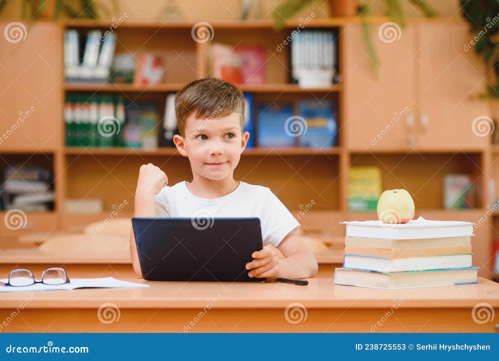 School Boy Using Tablet Compute in Classroom Stock Image - Image of ...