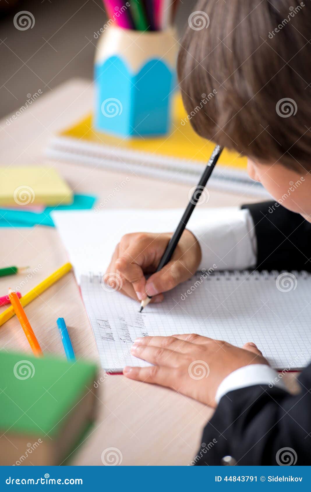 School Boy Writing in Notebook Stock Image - Image of library, table ...