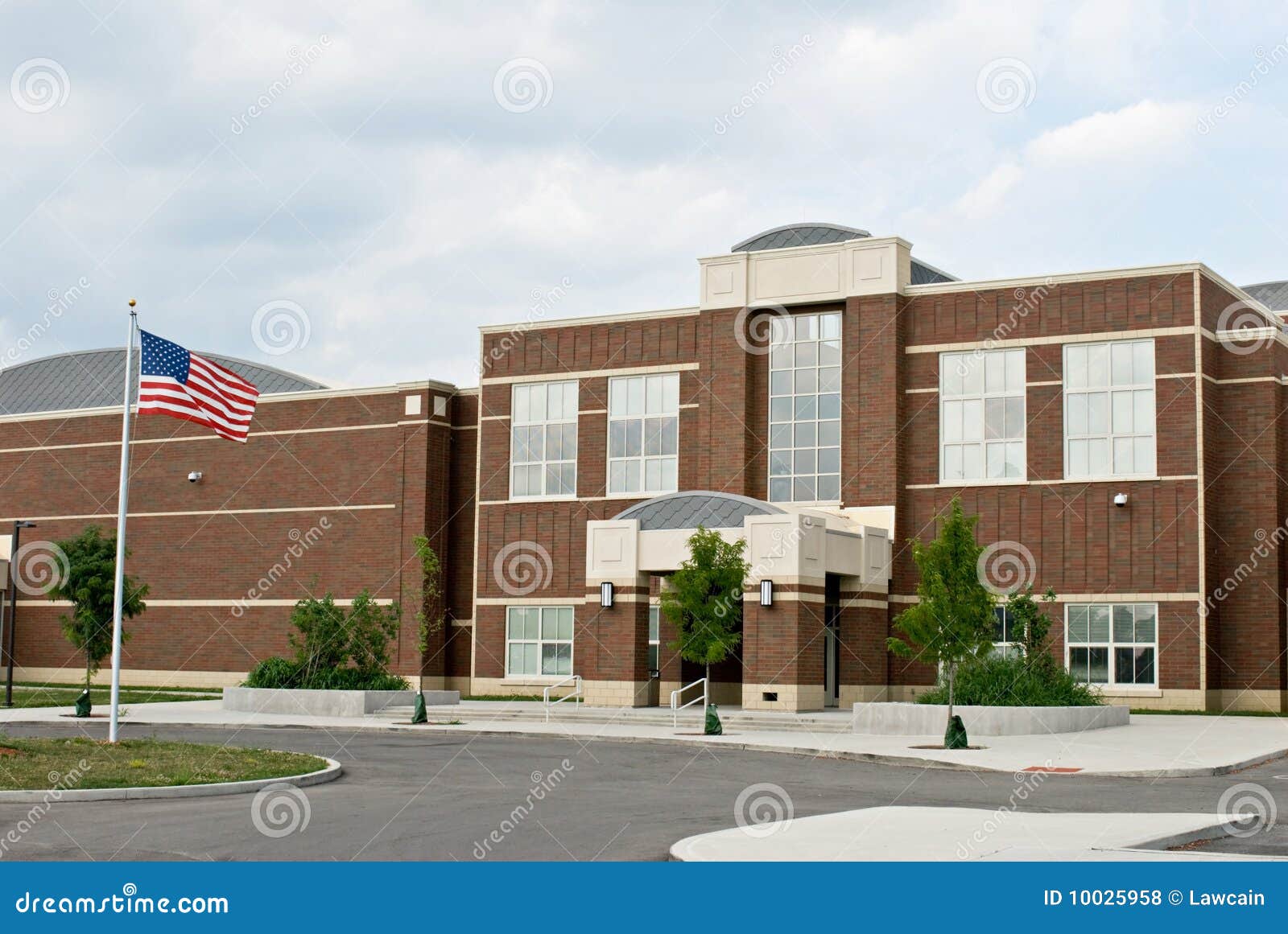 School Building with Flag stock photo. Image of clouds - 10025958