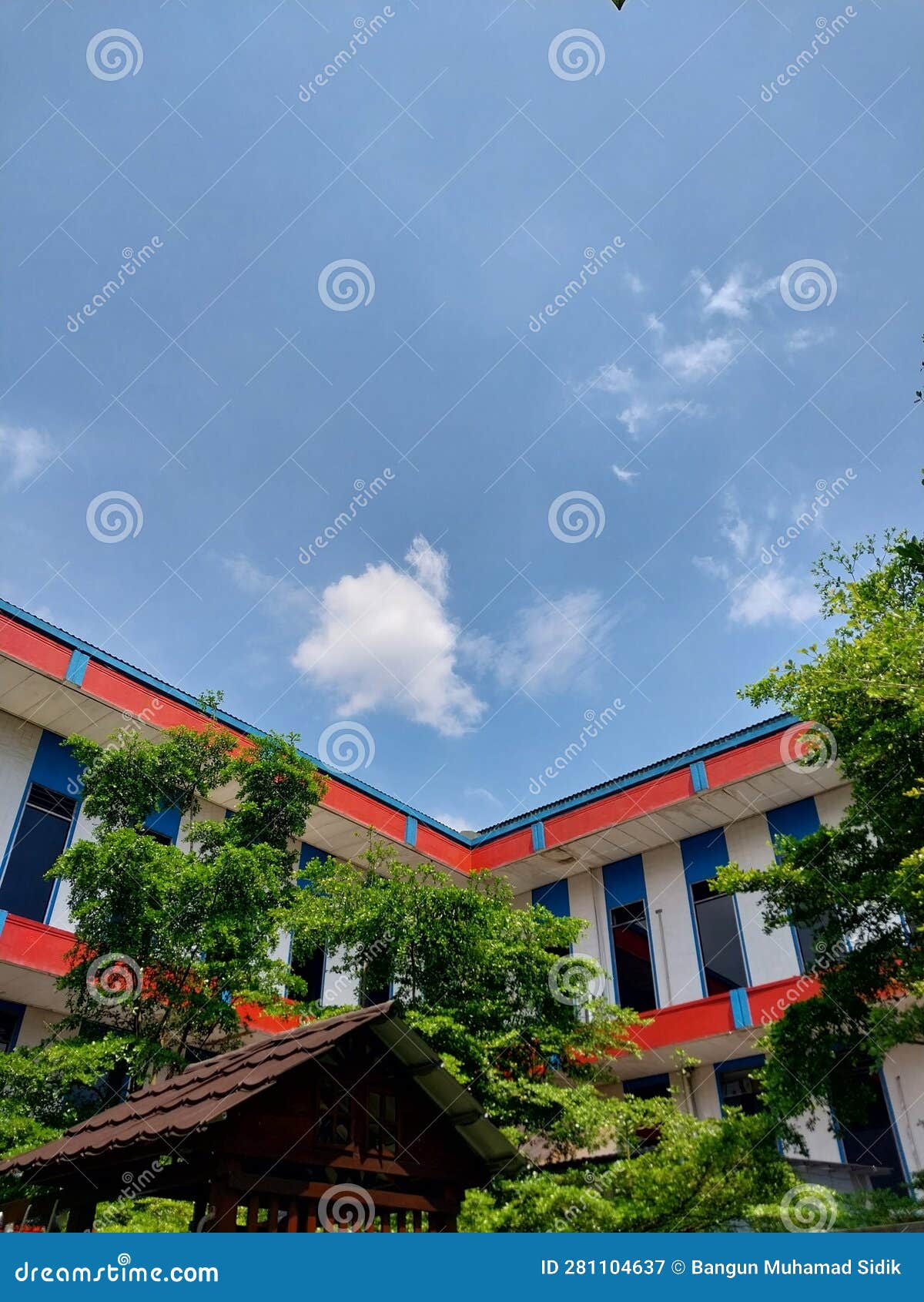 A School Building Surrounded by Beautiful Clouds and Sky. Stock Image ...