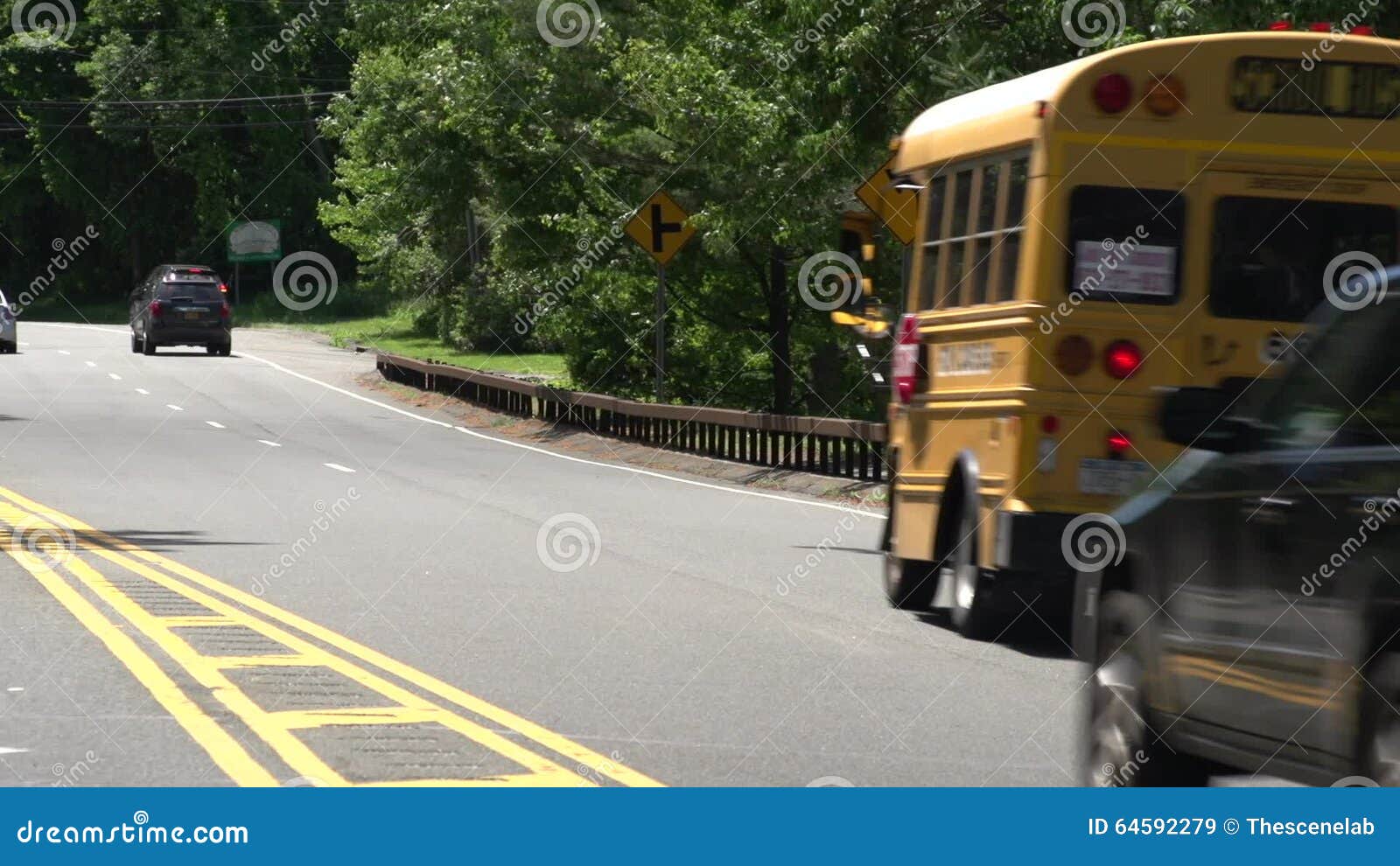 School Bus and Cars Driving by Stock Video - Video of group, road: 64592279