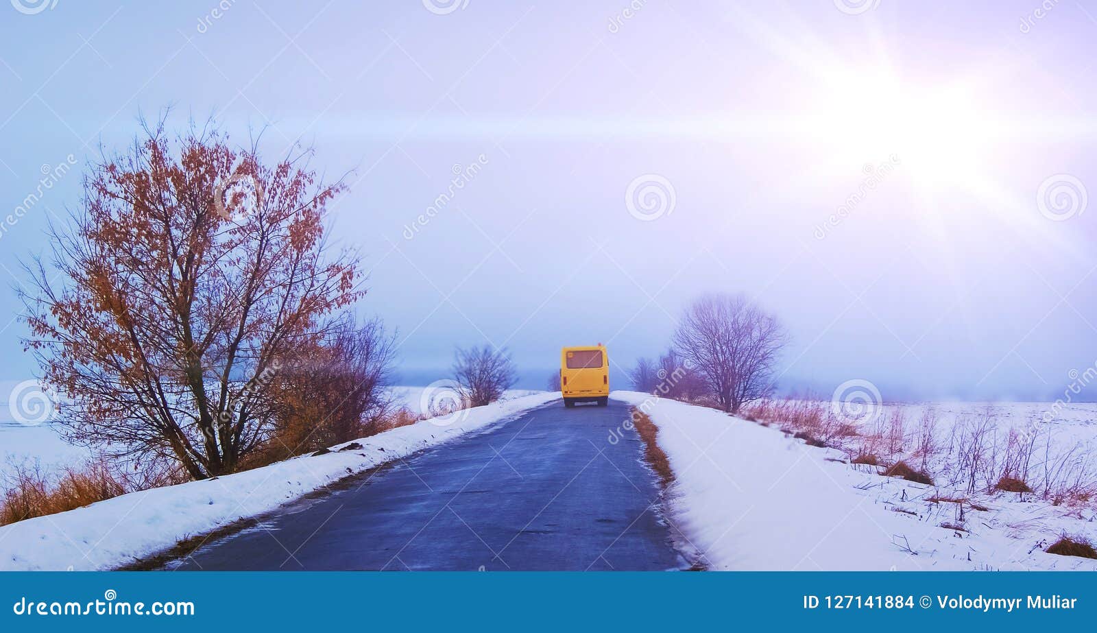 The School Bus Moves Along the Highway in Winter_ Stock Photo - Image ...