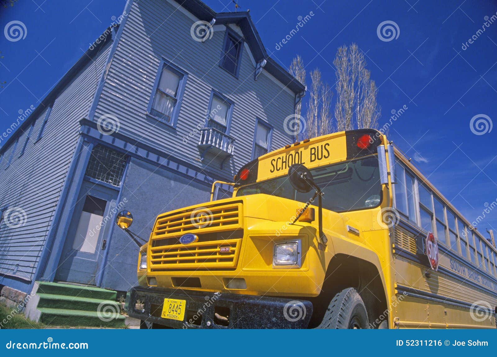 A School Bus Parked in Front of an Old Building, Port Wing, Wisconsin ...