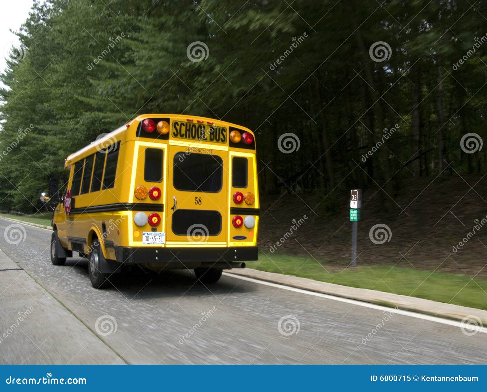School Bus Traveling on Road Stock Image - Image of traveling, yellow ...
