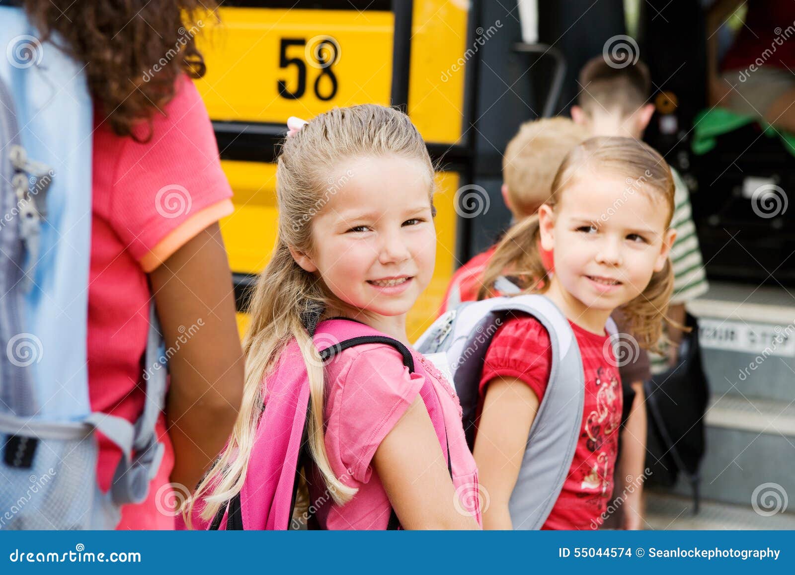 School Bus: Waiting To Get on the Bus Stock Photo - Image of male ...