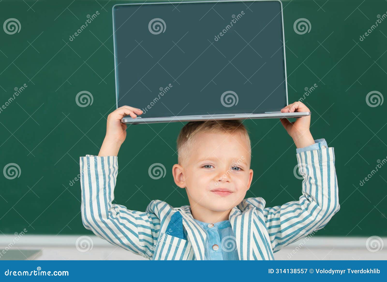 School Child Holding Laptop on Head Using Digital Pc Laptop in Class ...